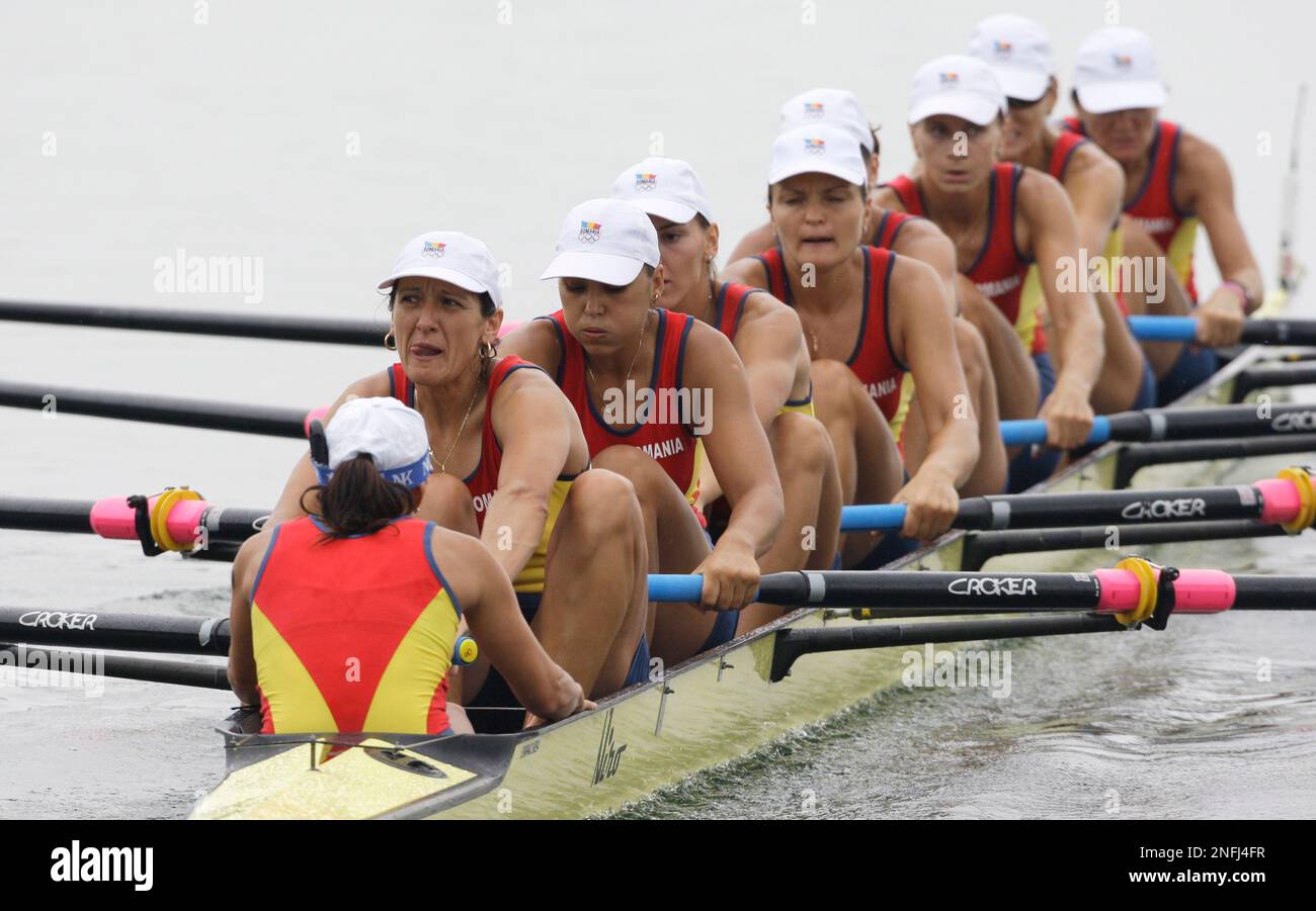 Romania's coxswain Elena Georgescu and teammates Doina Ignat, Georgeta ...