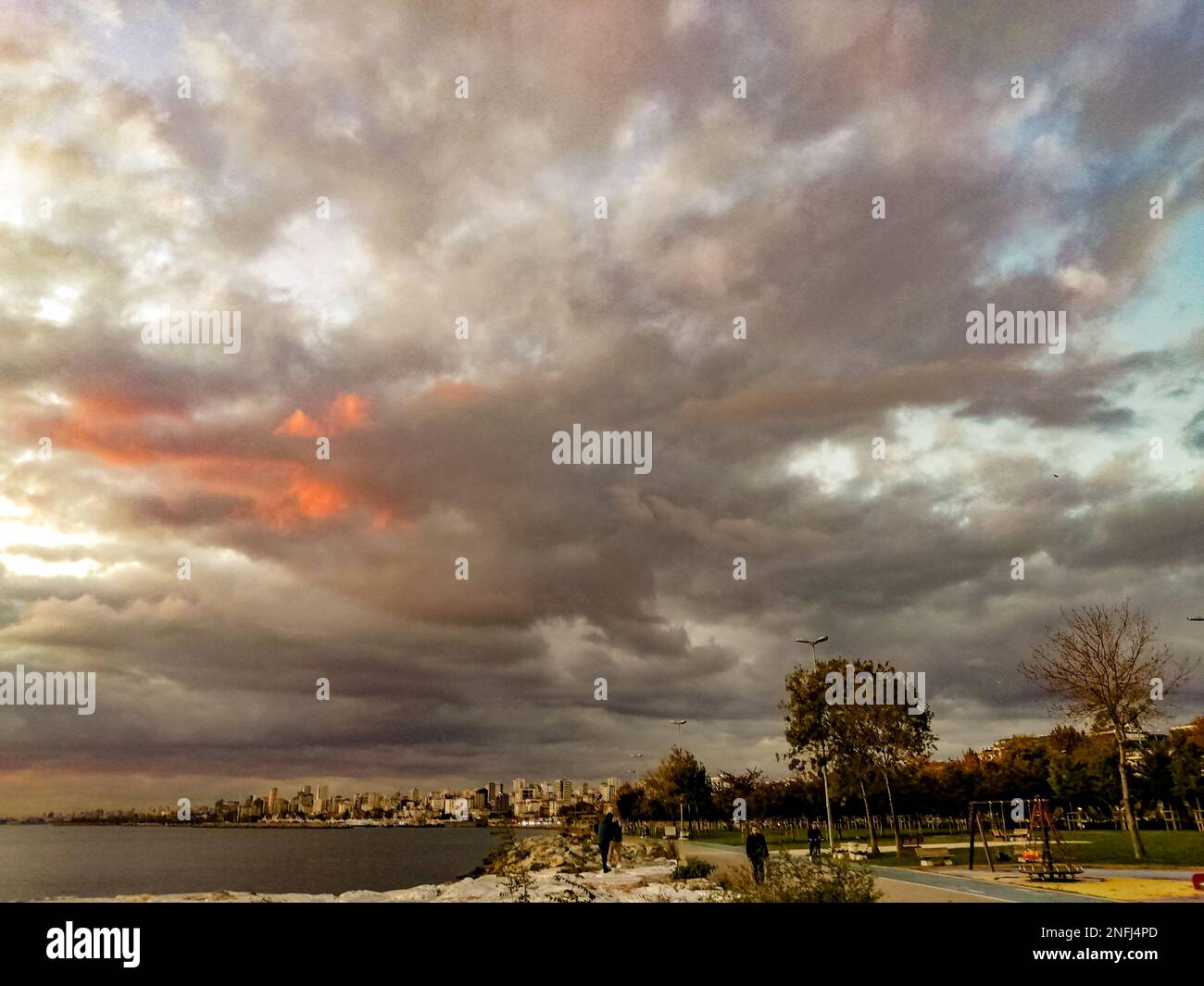 View of sunset from Istanbul Küçükyalı. Colourful clouds, sea and city ...