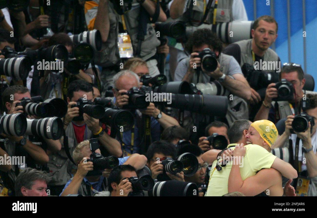 Australia's Lisbeth Trickett is photographed as she hugs an ...