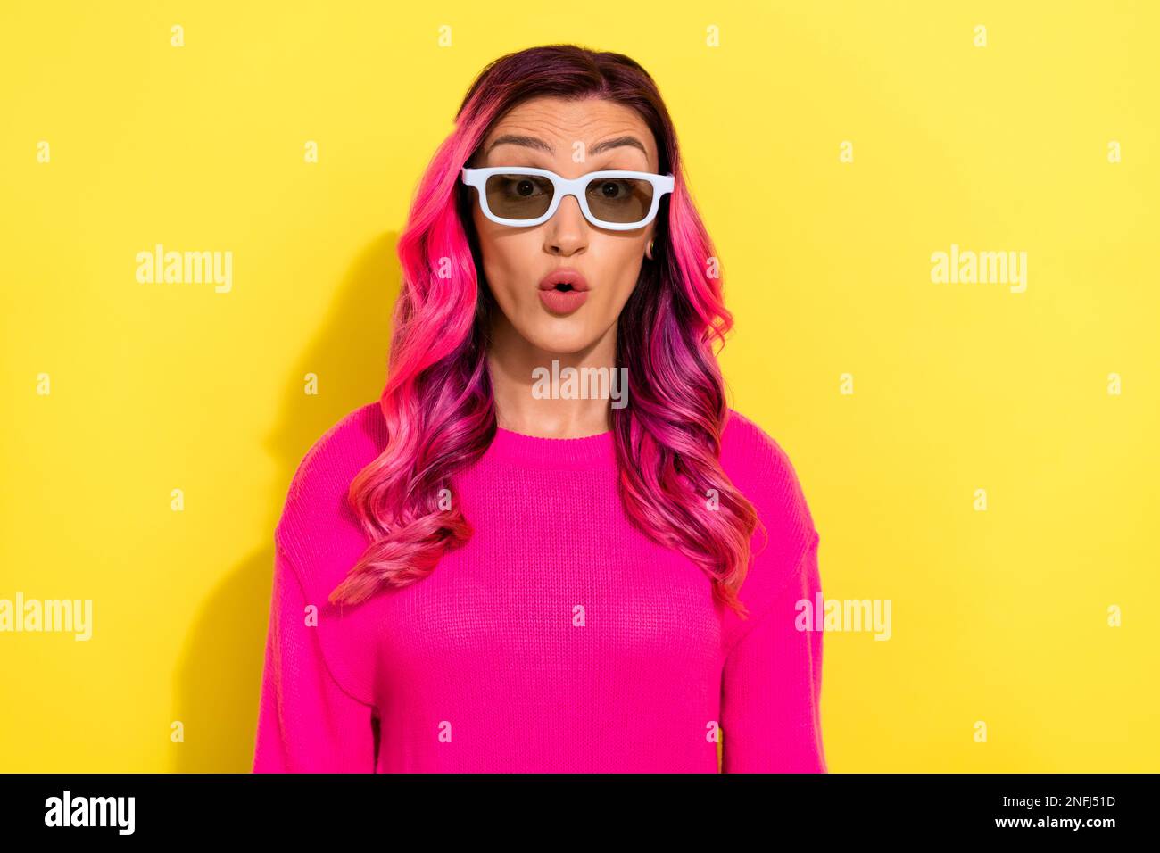 Photo of impressed girl pouted lips staring speechless unbelievable ...