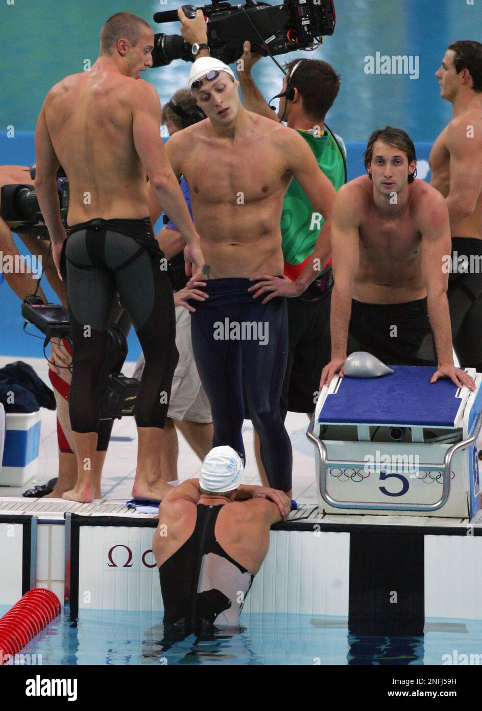 French relay team members show their dejection after finishing second ...