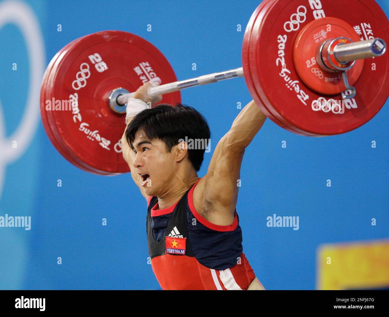 Anh Tuan Hoang of Vietnam lifts 130 kilograms in the snatch during the ...