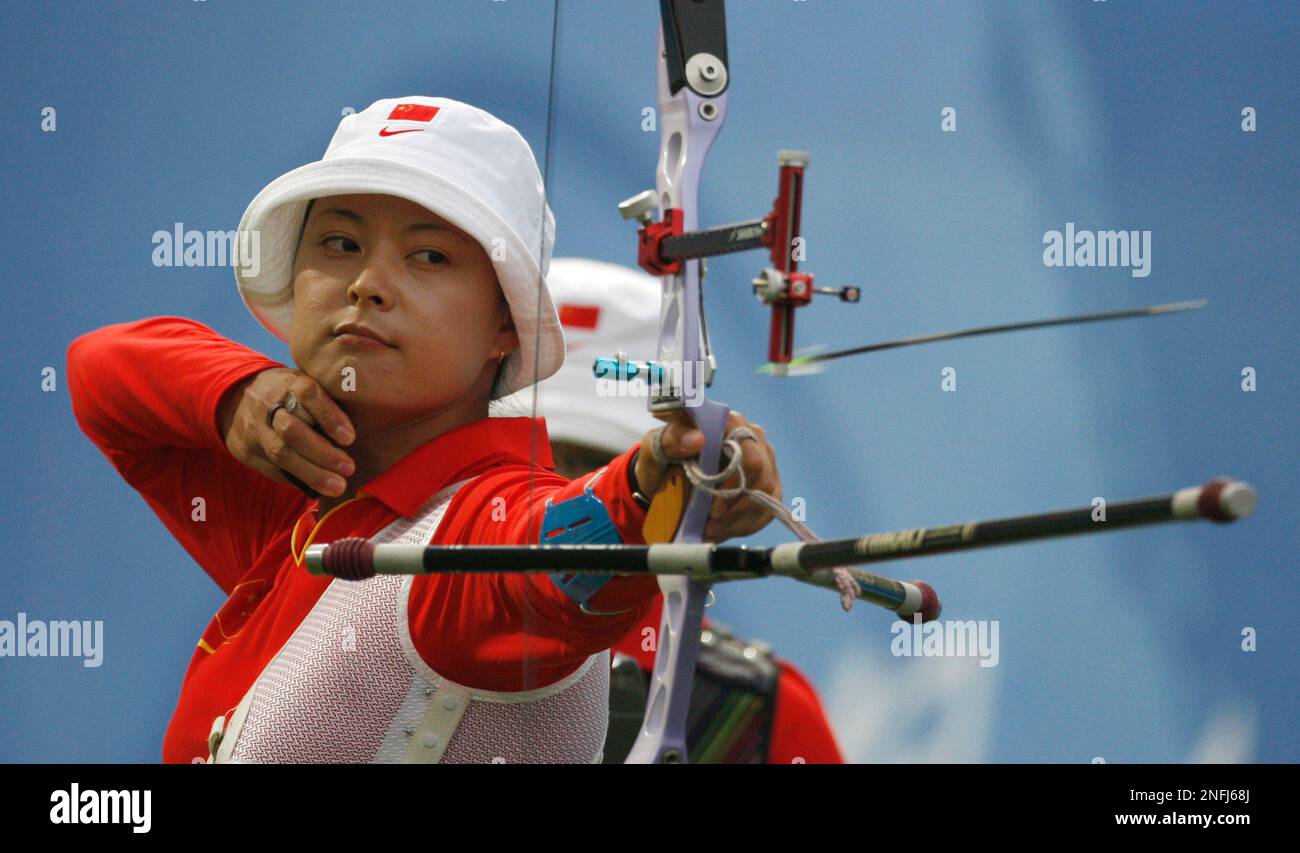 Guo Dan of China releases an arrow during the gold medal match for the ...