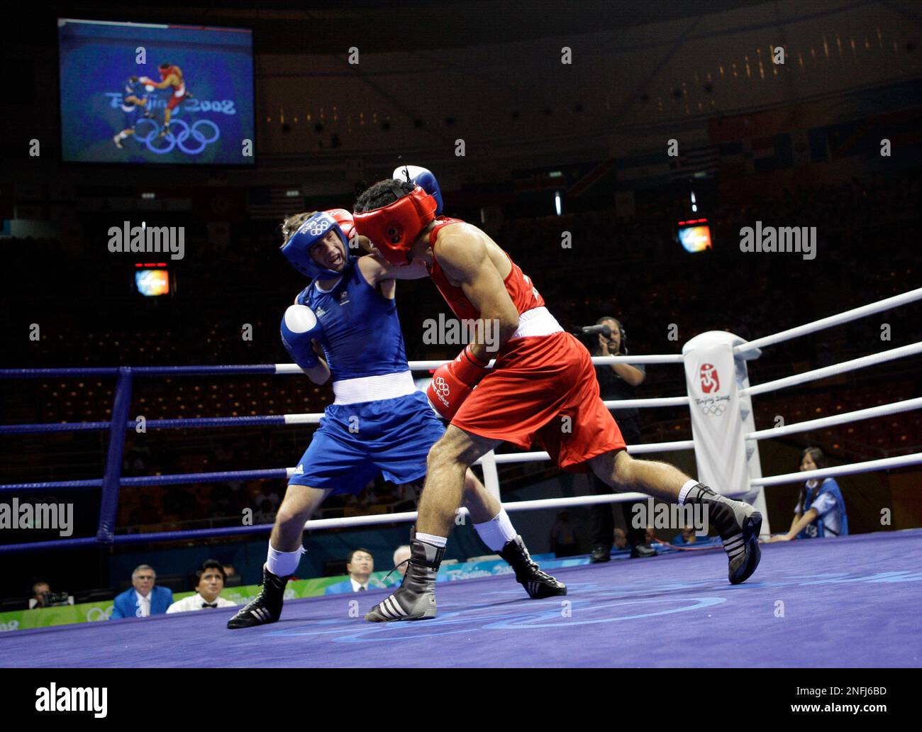 Driss Moussaid, red of Morocco and Todd Kidd, blue, of Australia, fight ...