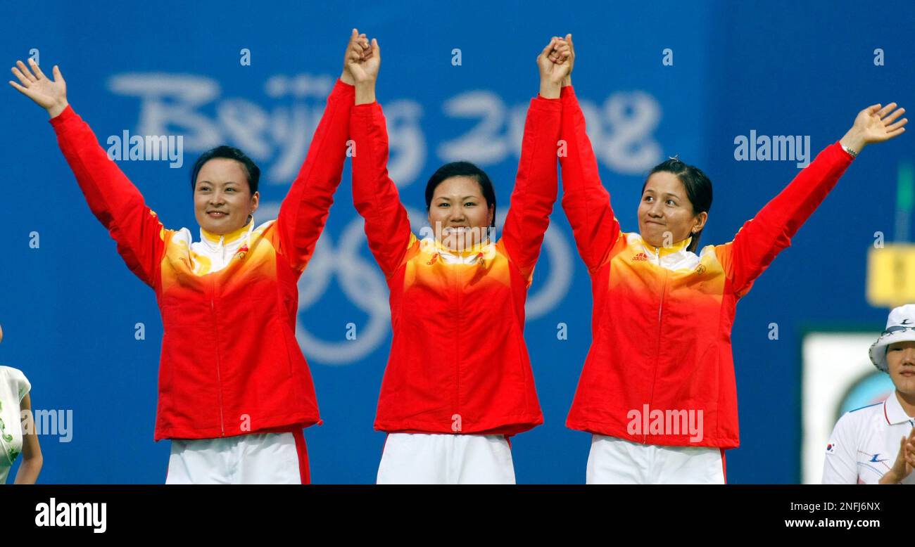 China's Guo Dan, left, Zhang Juanjuan, center, and Chen Ling celebrate ...