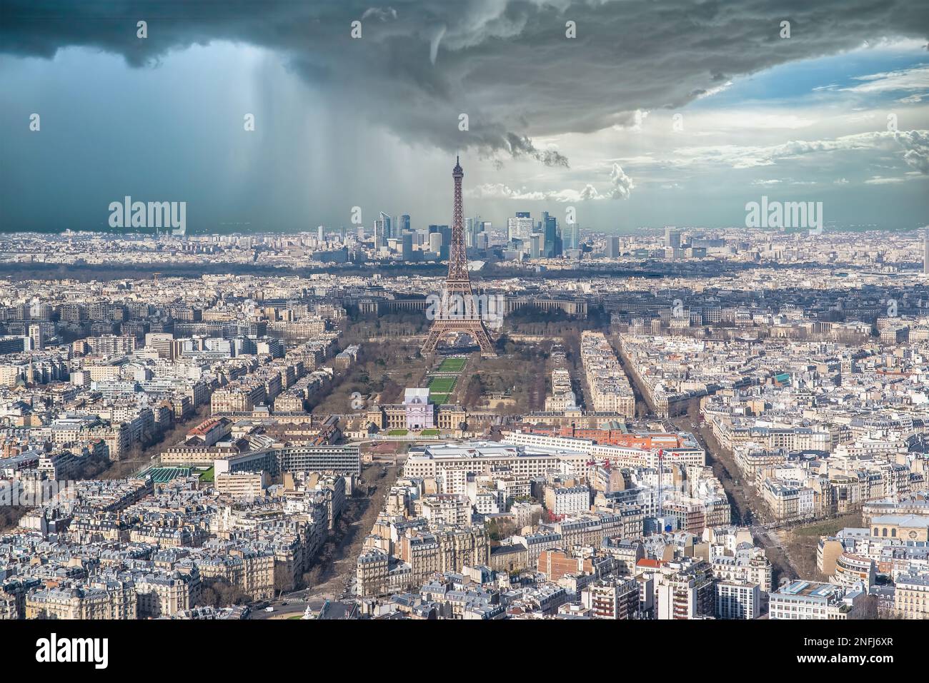 Paris, aerial view of the Eiffel Tower in a storm, with the Defense ...