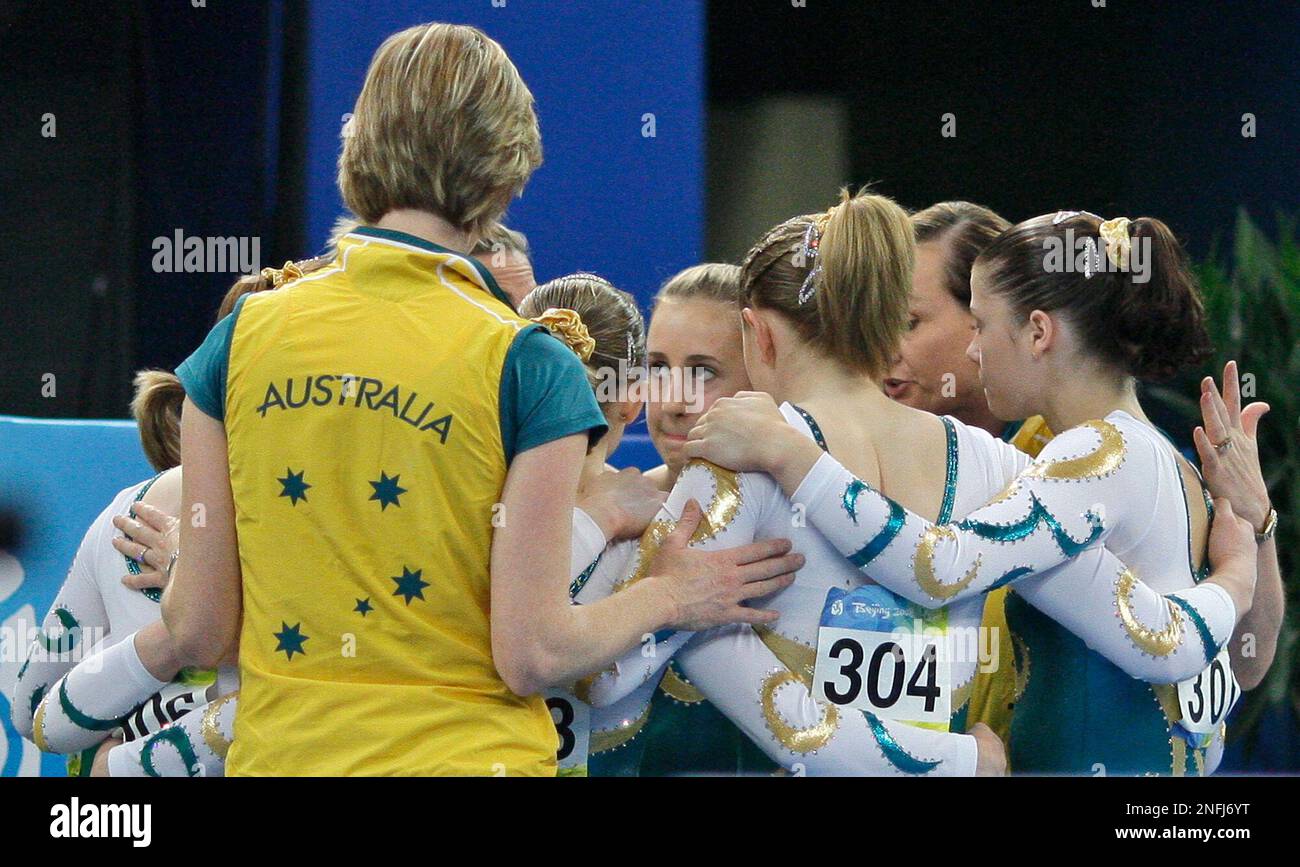 The Australian national gymnastics team huddles during the women's ...