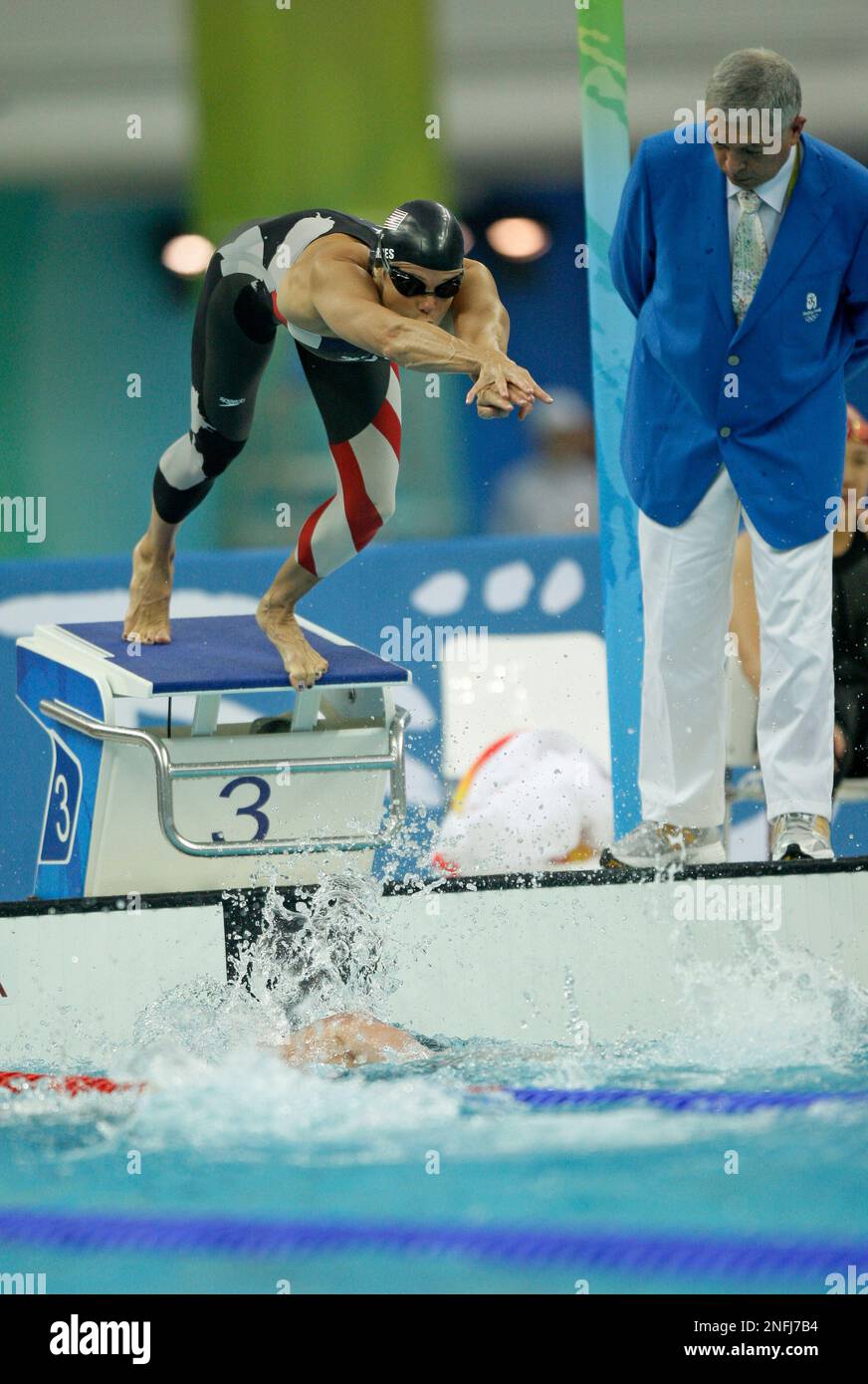 U.S. swimmer Dara Torres dives into the pool for her leg in the women's ...