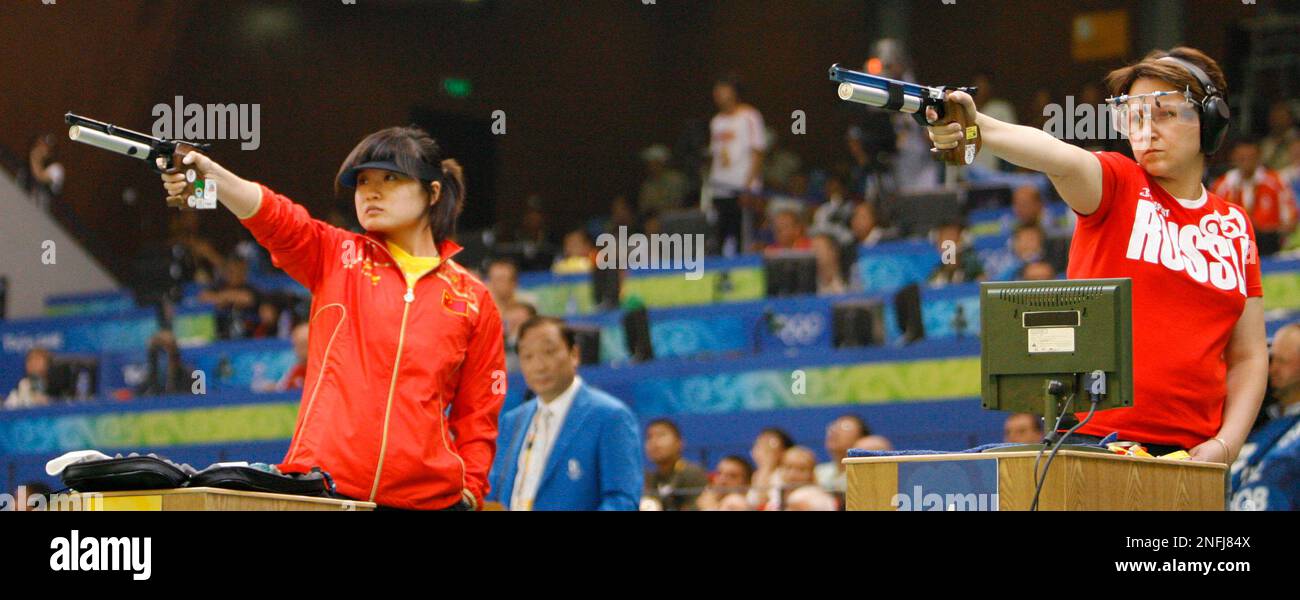 Russia's Natalia Paderina, right, and China's Guo Wenjun shoot during ...