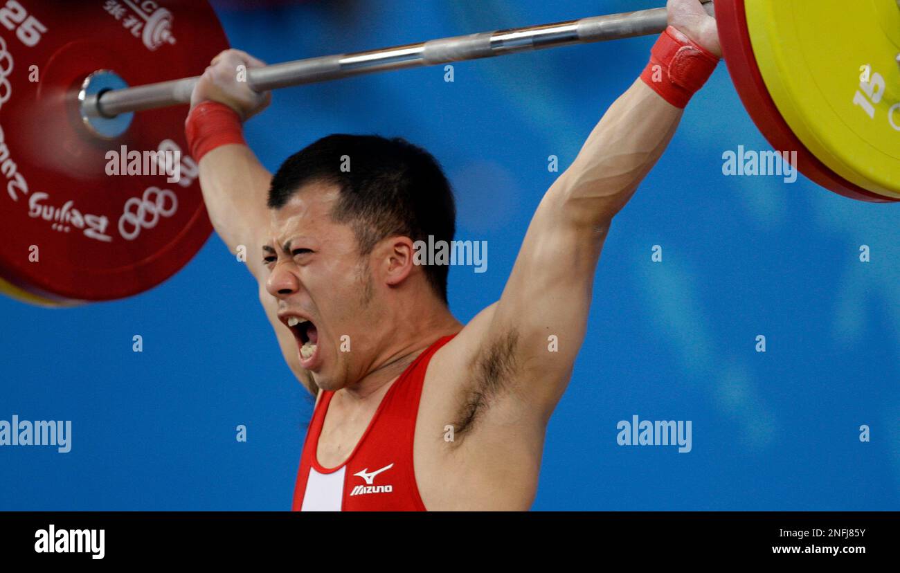 Masaharu Yamada of Japan yells while holding up 103 kilograms in the ...