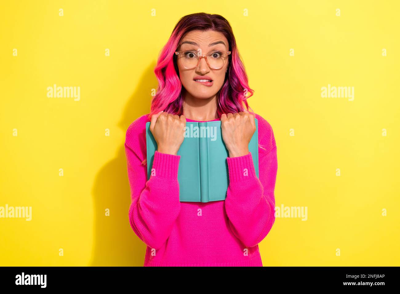 Photo of afraid scared girl dressed vibrant pullover eyewear reading ...