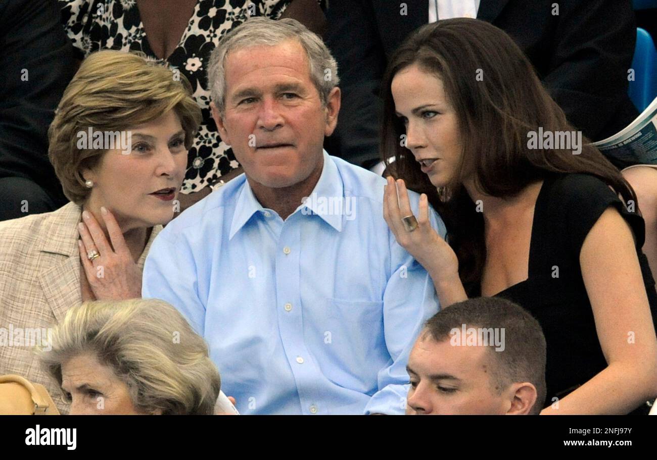 U.S. President George W. Bush, center, his wife Laura Bush, left, and ...