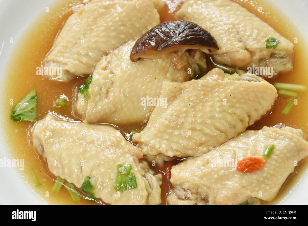 boiled chicken wing with Chinese herb stew on plate Stock Photo - Alamy