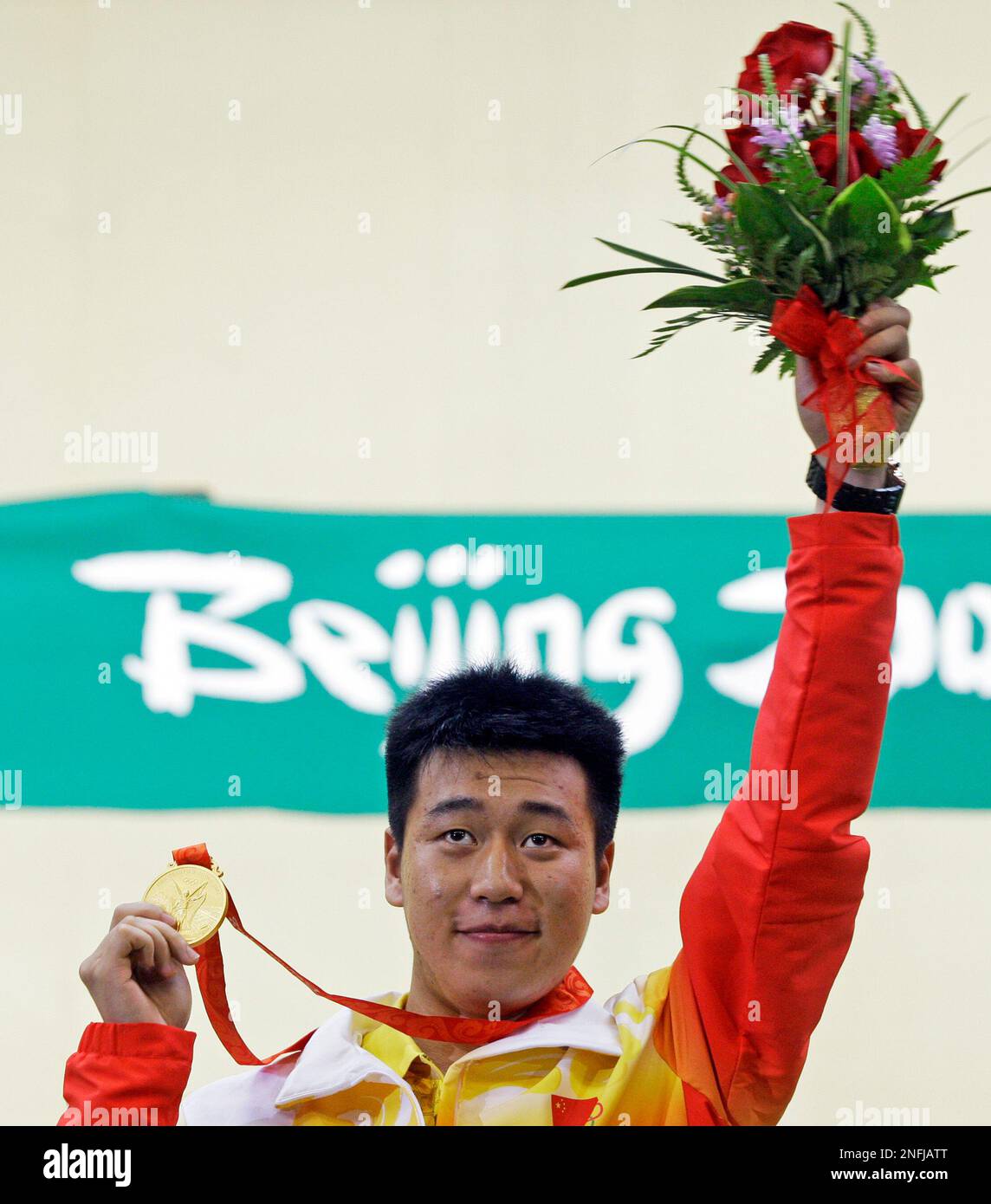 China's Wei Pang shows off his gold medal during medal ceremony at the ...
