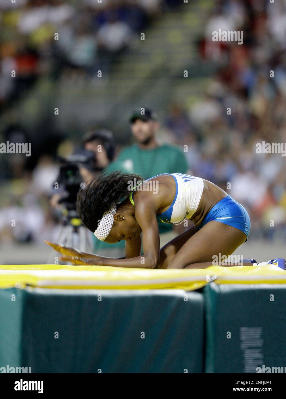 Chaunte Howard reacts after clearing the bar in the women's high jump ...