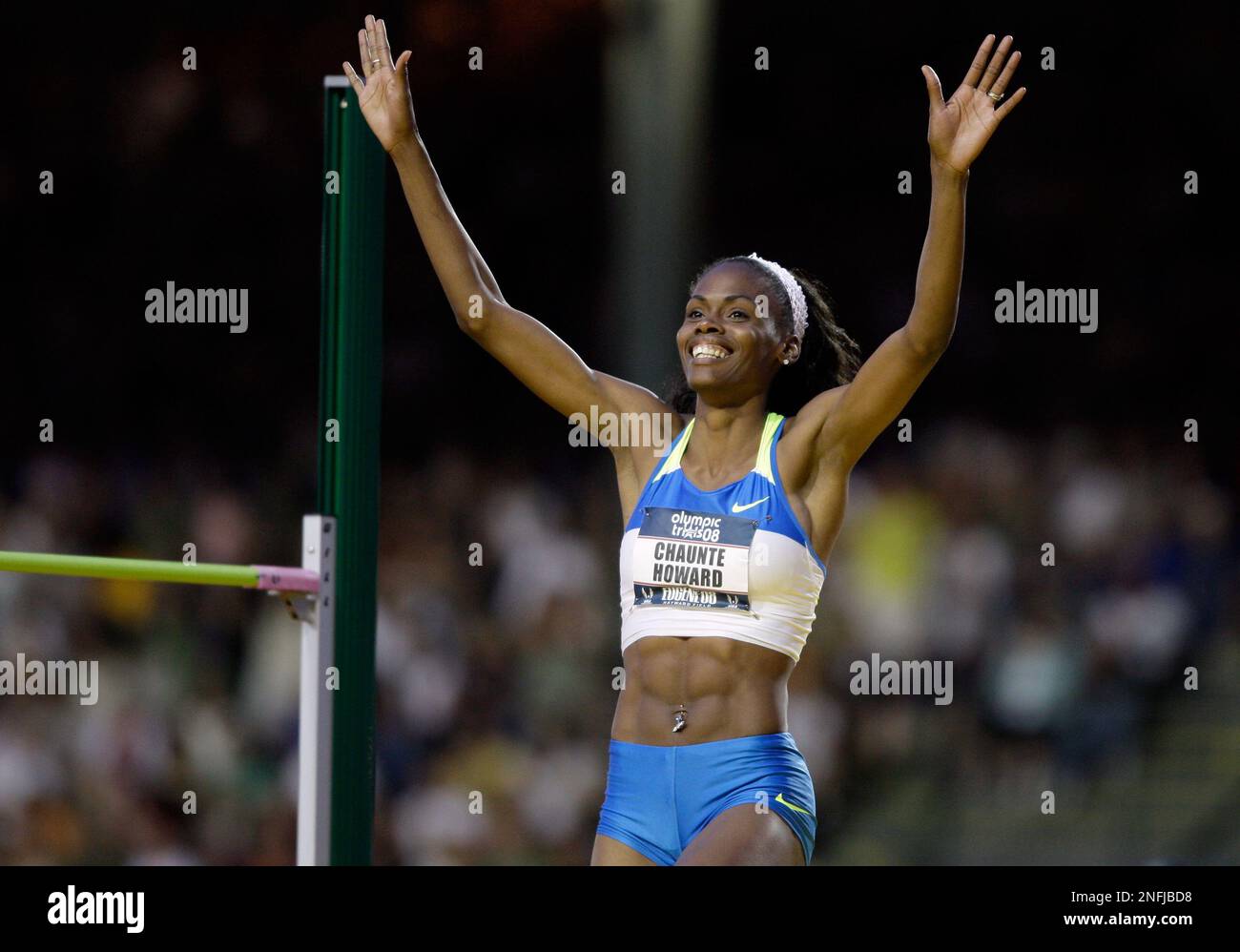 Chaunte Howard reacts after clearing the bar in the women's high jump ...