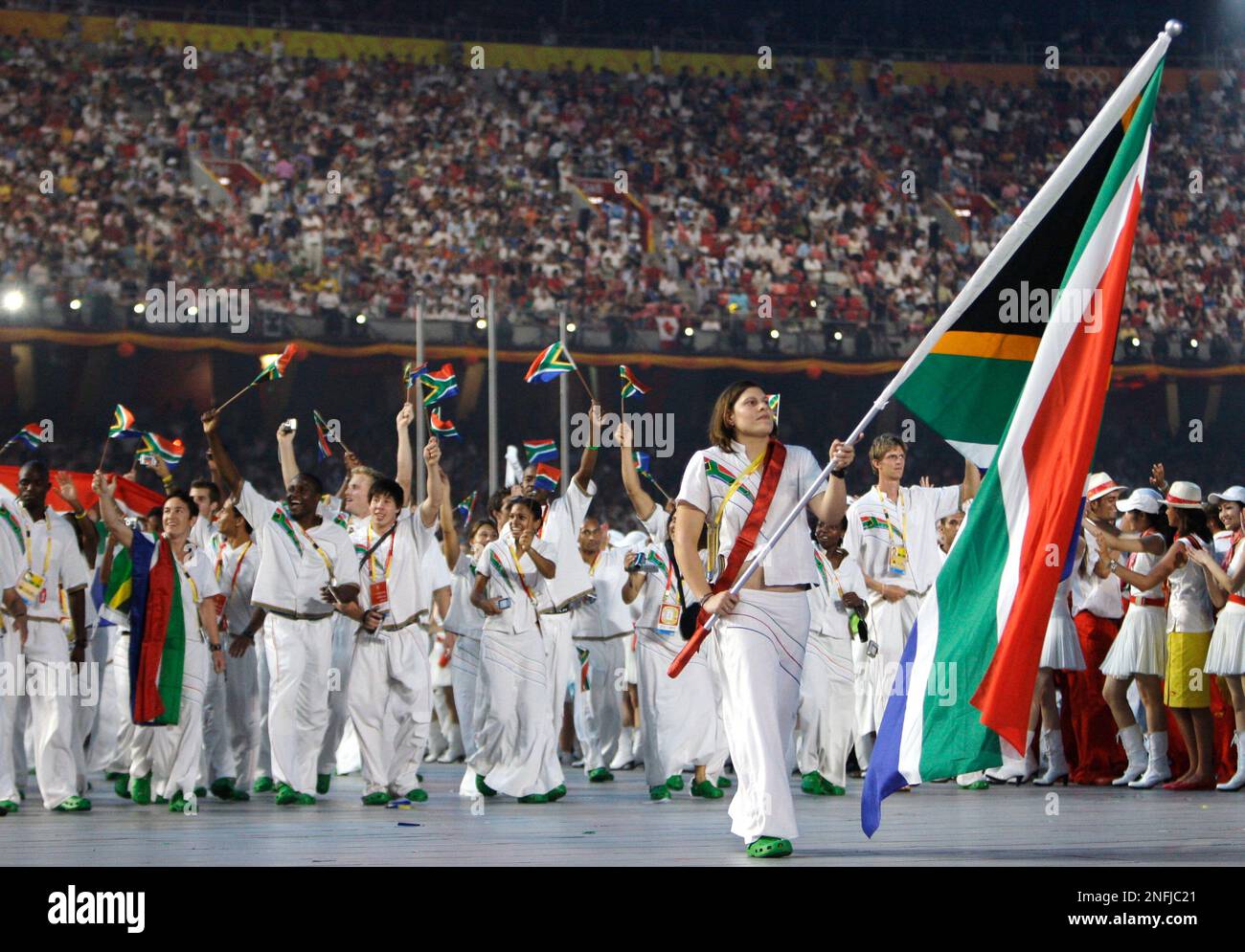 Natalie Du Toit carries the flag of South Africa during the opening ...