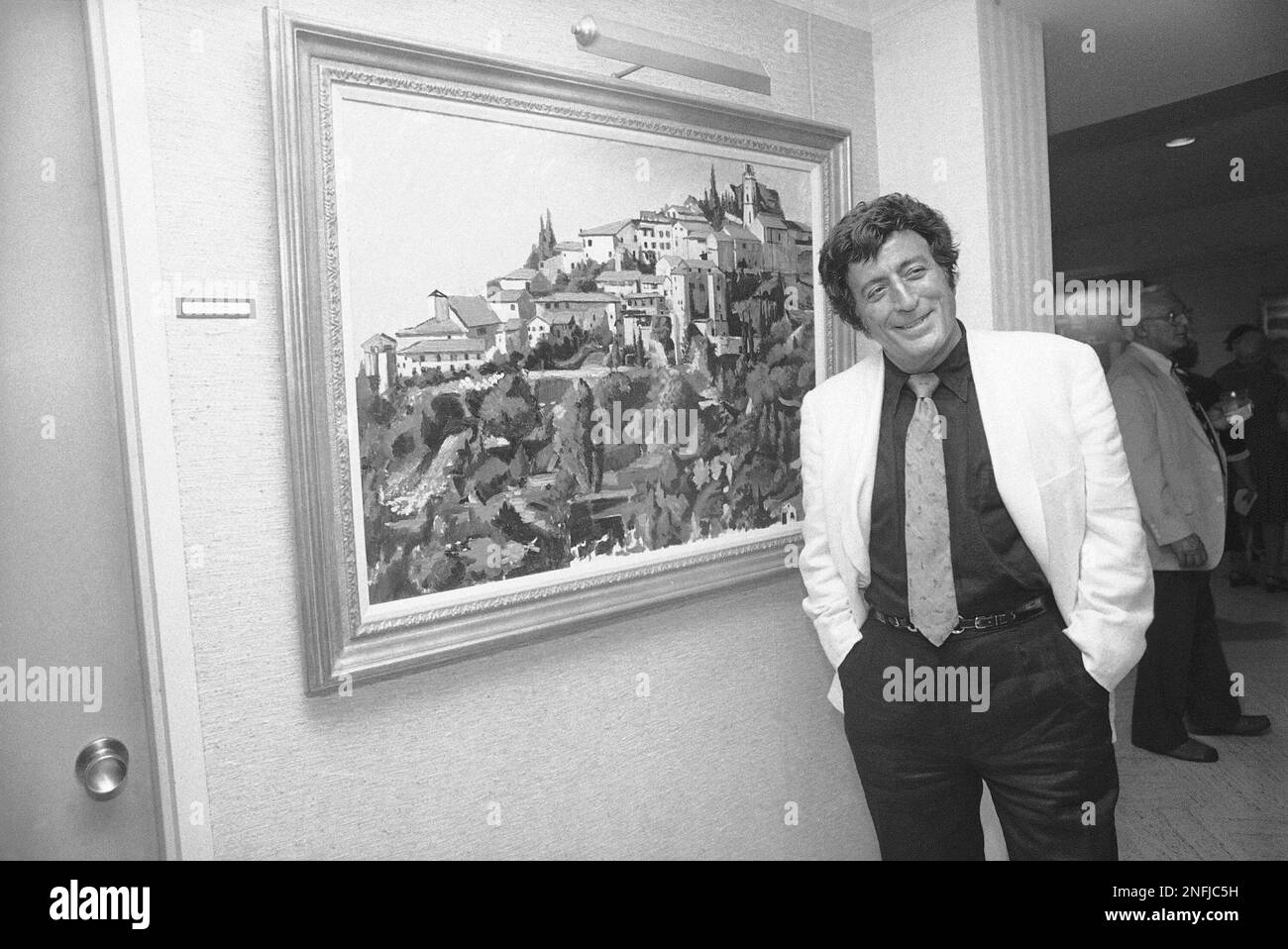 Singer Tony Bennett stands next to paintings titled "South of France ...