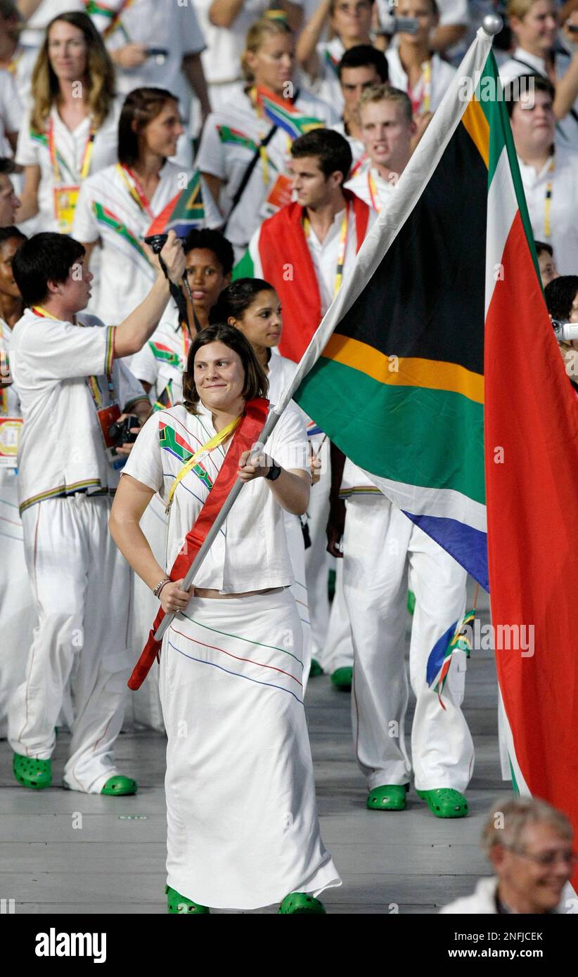 Natalie Du Toit carries the flag of South Africa during the opening ...
