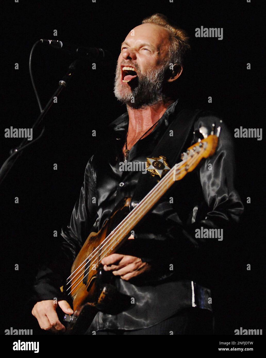 Lead vocalist and bassist Sting and his band The Police perform their ...