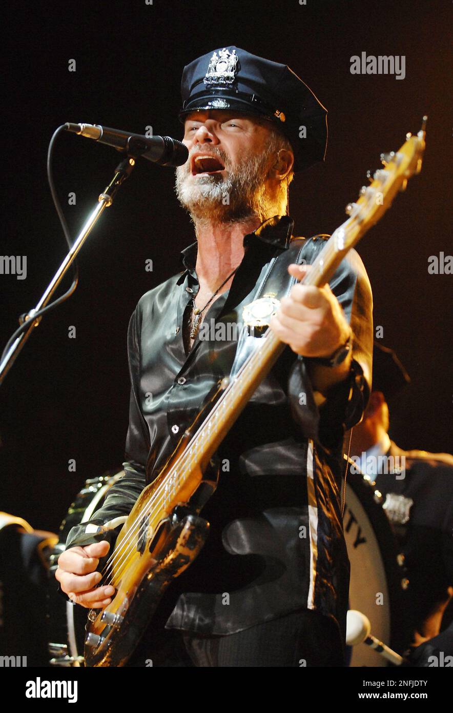 Lead vocalist and bassist Sting and his band The Police perform their ...