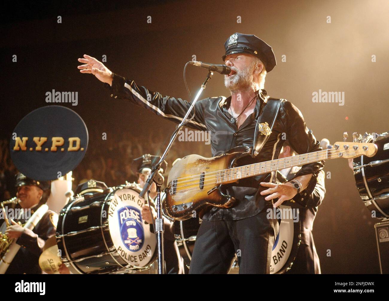 Lead vocalist and bassist Sting, center, and his band The Police are ...