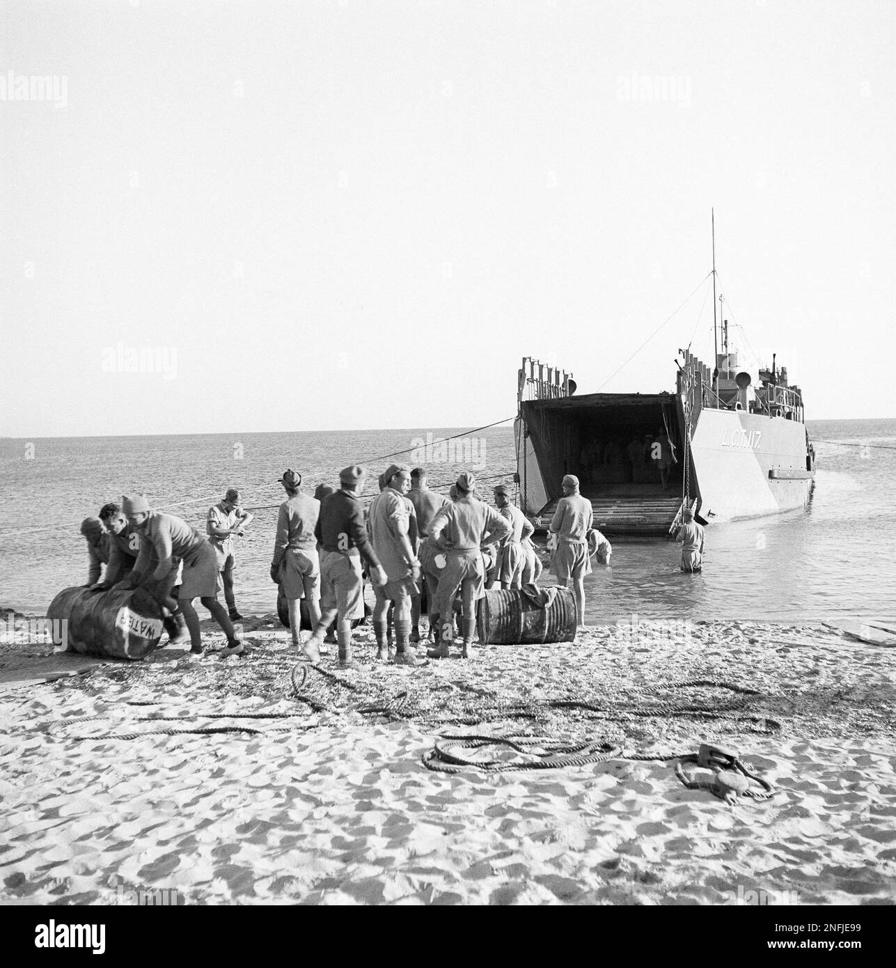 A tank landing craft beaching on March 14, 1943 at Sollum with water ...