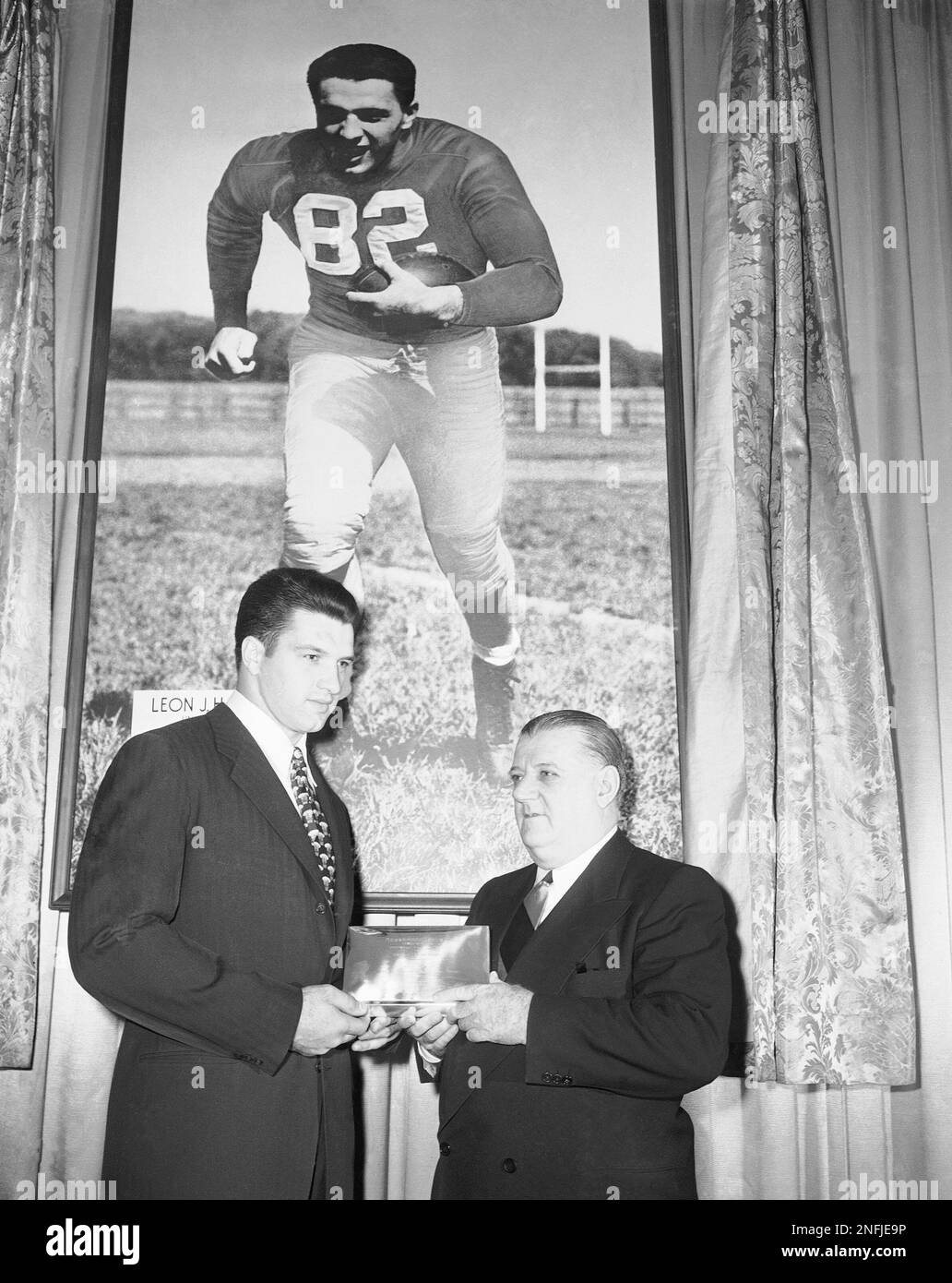 Leon Hart, left, Notre Dame's All-America end, receives the Maxwell ...