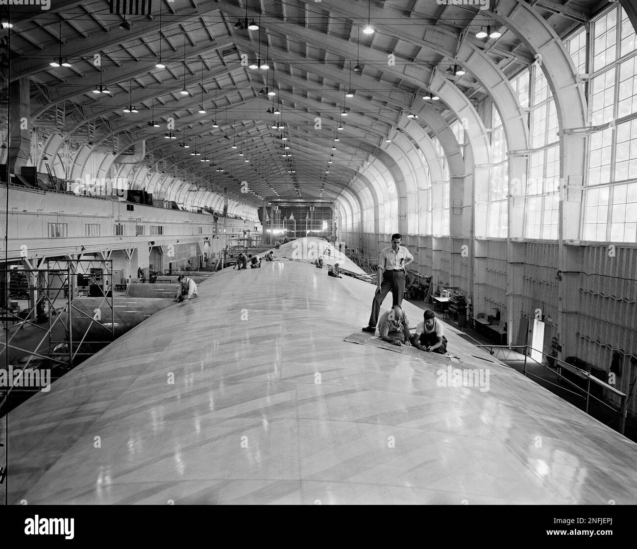 Workmen are putting the finishing touches on the 320-foot wing for the ...
