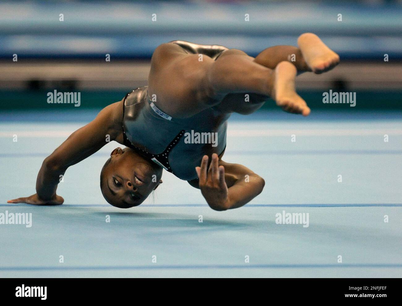 Brazilian gymnast Daiane Santos performs a floor routine during podium ...