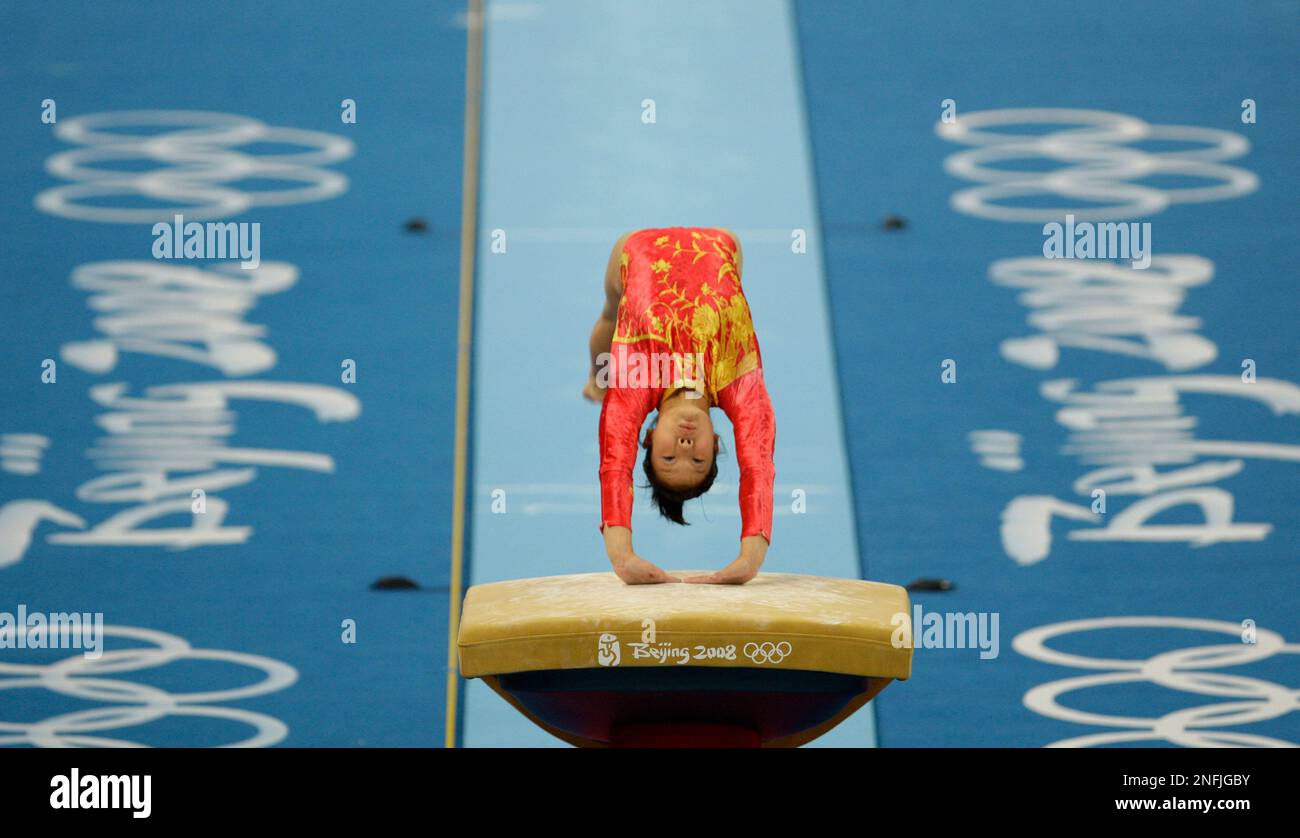 Chinese gymnast Cheng Fei performs on the vault during a podium ...