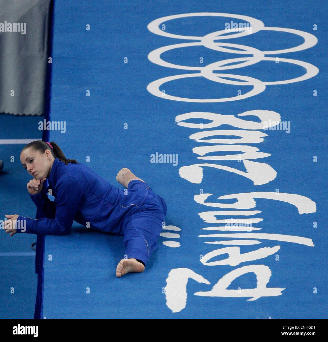 U.S. gymnast Chellsie Memmel stretches during a podium training ahead ...