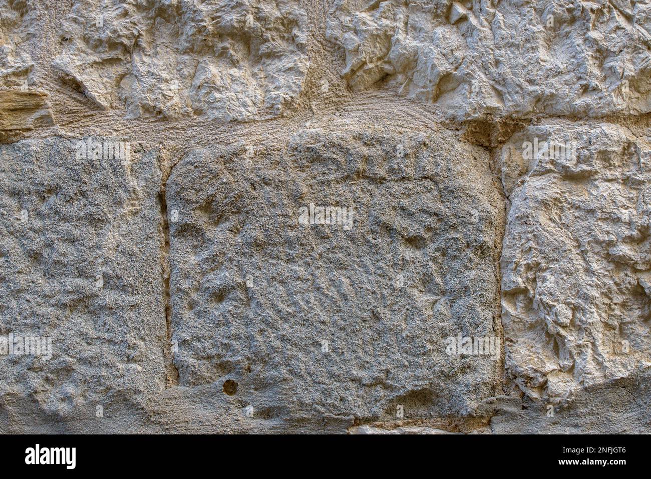 This close-up photo of a brick wall captures the rugged texture and ...