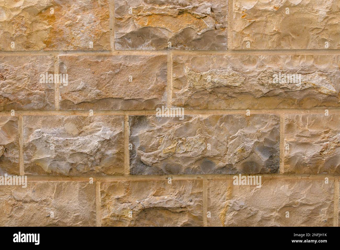 This close-up photo of a brick wall captures the rugged texture and ...