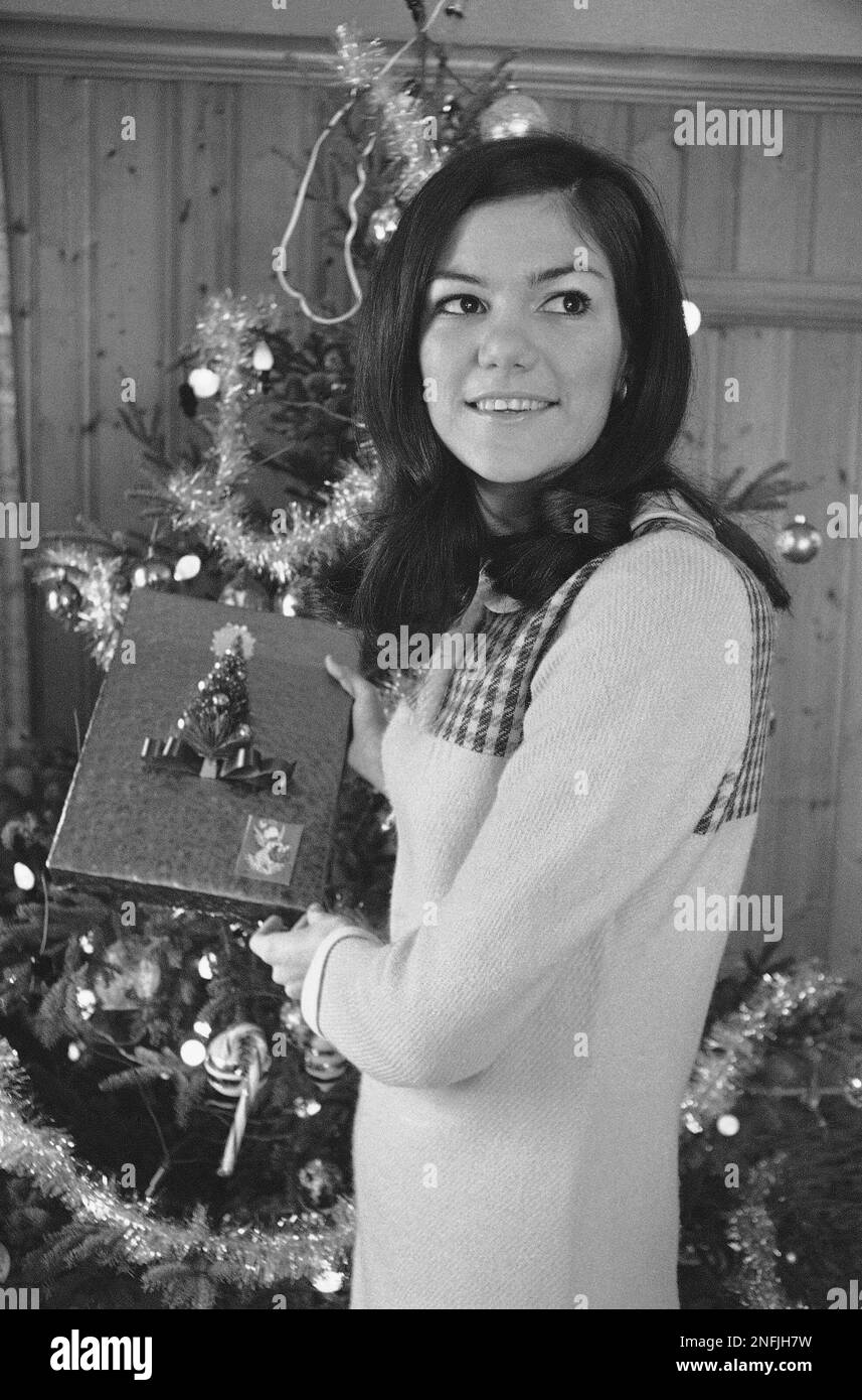 Barbara Jane Mackle trims the Christmas tree at her home in Miami, Dec ...