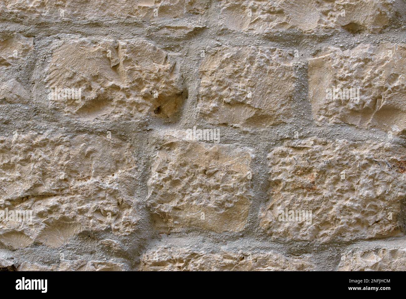 This close-up photo of a brick wall captures the rugged texture and ...