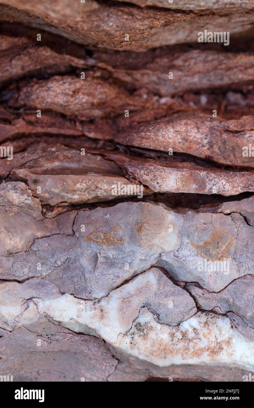 This close-up photo of rocks showcases the rugged, natural beauty of the geological formations ...