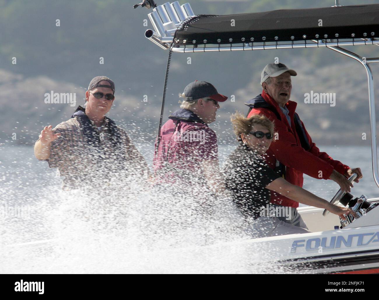Former President George Herbert Walker Bush, far right, on his boat ...