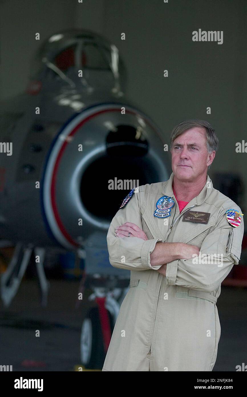 Capt. Dale Snodgrass, USN (Ret.), stands next to his F-86 Sabre jet ...