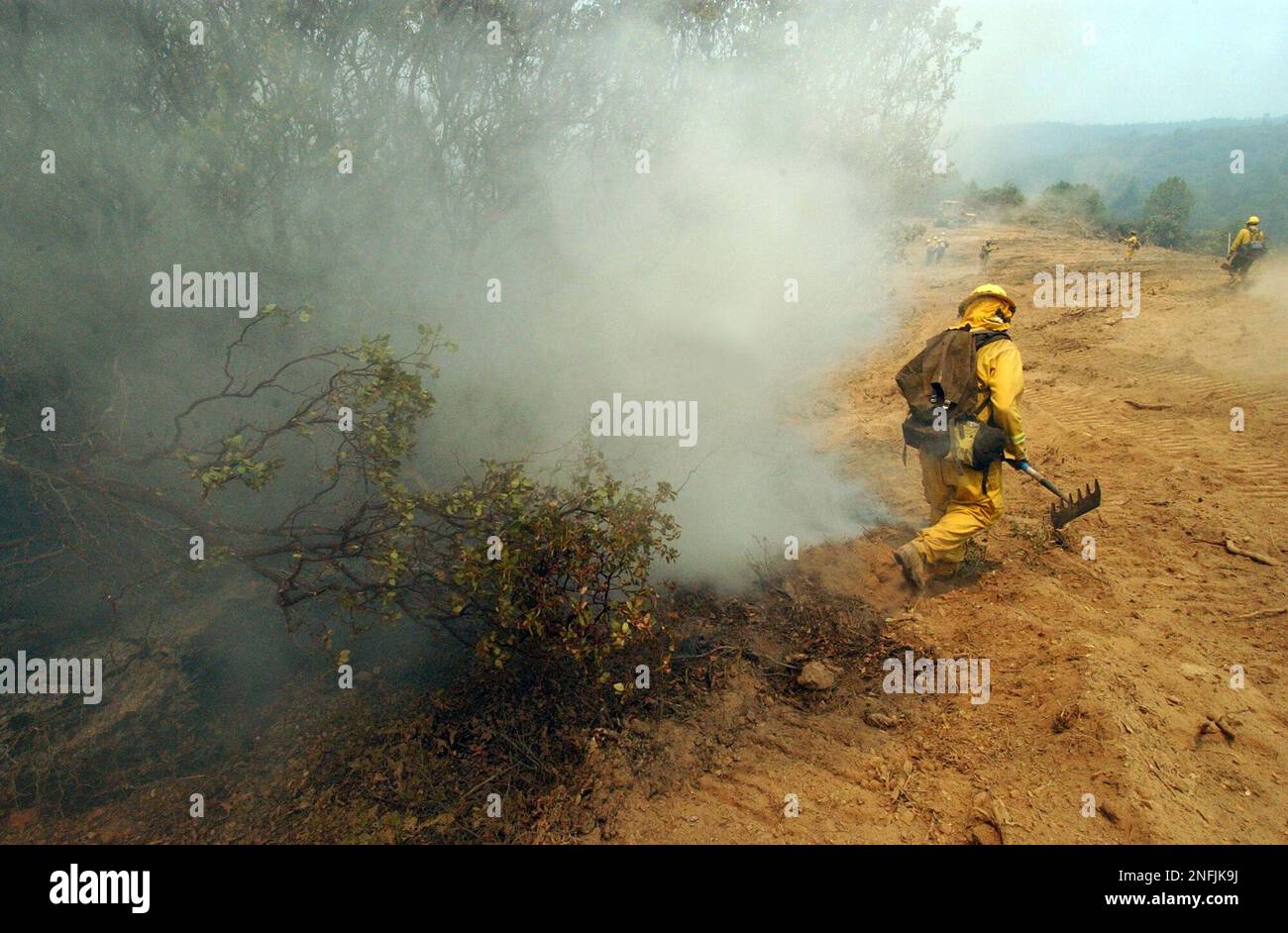Firecrews cut fireline on the the Telegraph Fire near Yosemite National ...