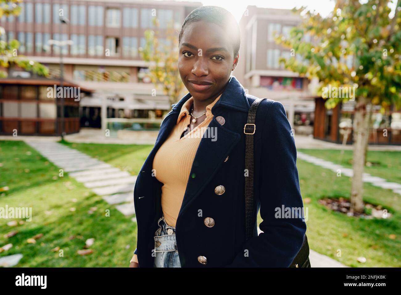 Stylish african female student near university campus Stock Photo - Alamy