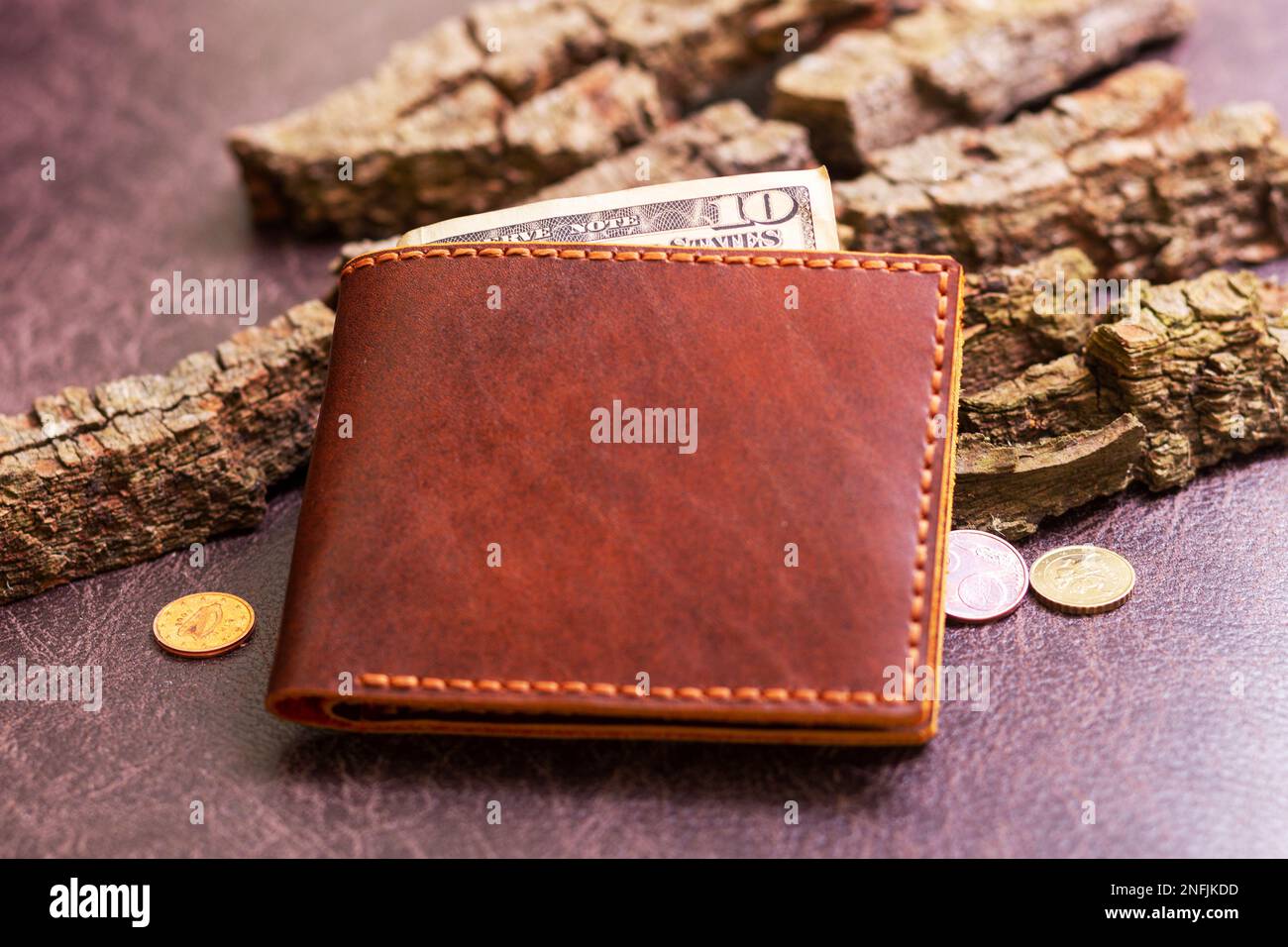 Open brown mens wallet with money and credit cards on leather ...