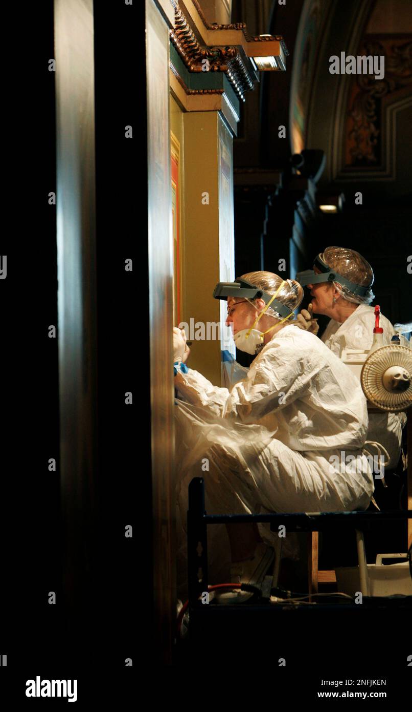 Conservators Christiana Cunningham-Adams, right, and Laurie Timm, left ...