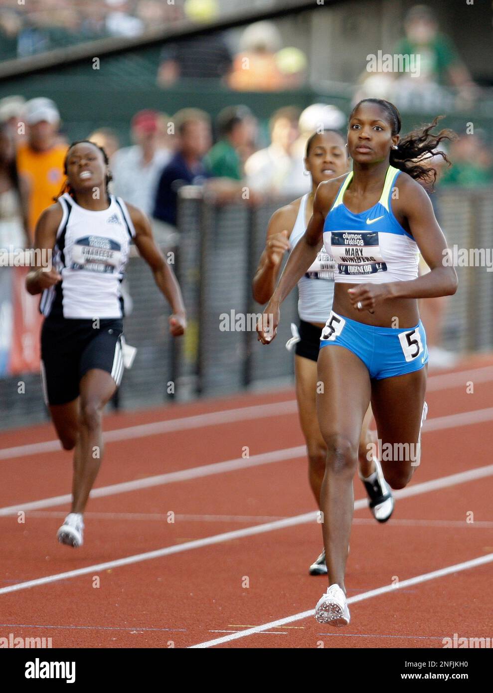 Mary Wineberg, right, crosses the finish line ahead of Debbie Dunn in ...