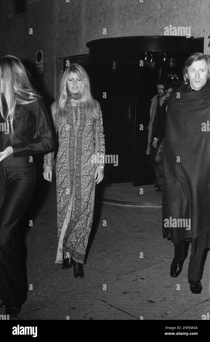 French actress Brigitte Bardot wears a maxi length outfit as she leaves ...