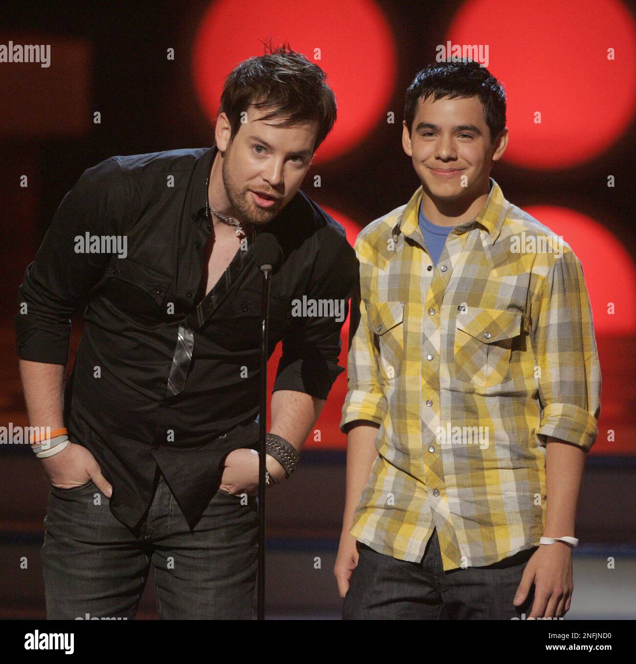 Singers David Cook, left, and David Archuleta are seen on stage at the ...