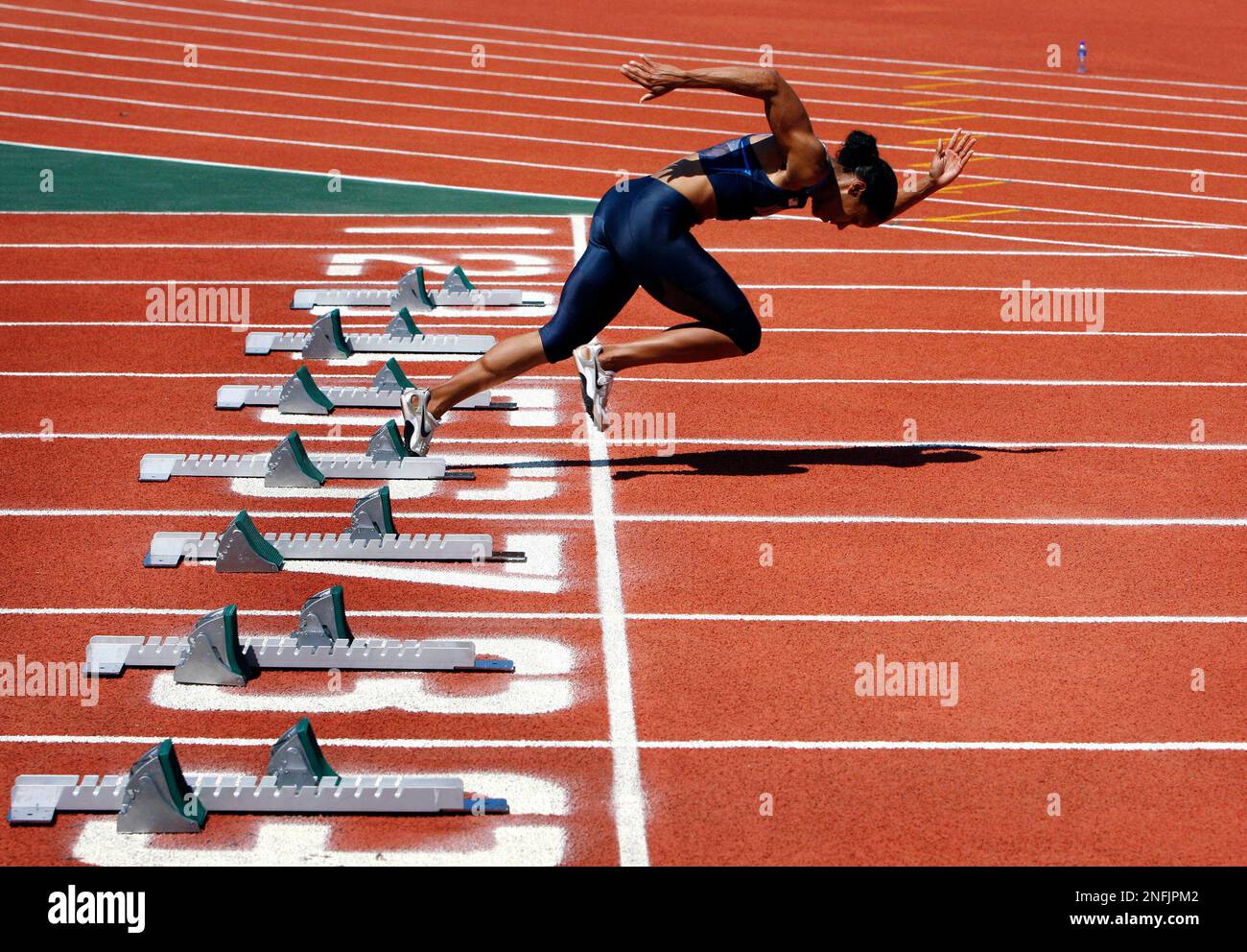 U.S. women's 100-meter sprinter Torri Edwards practices on the starting ...