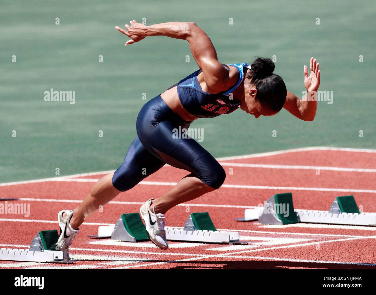 U.S. women's 100-meter sprinter Torri Edwards practices on the starting ...