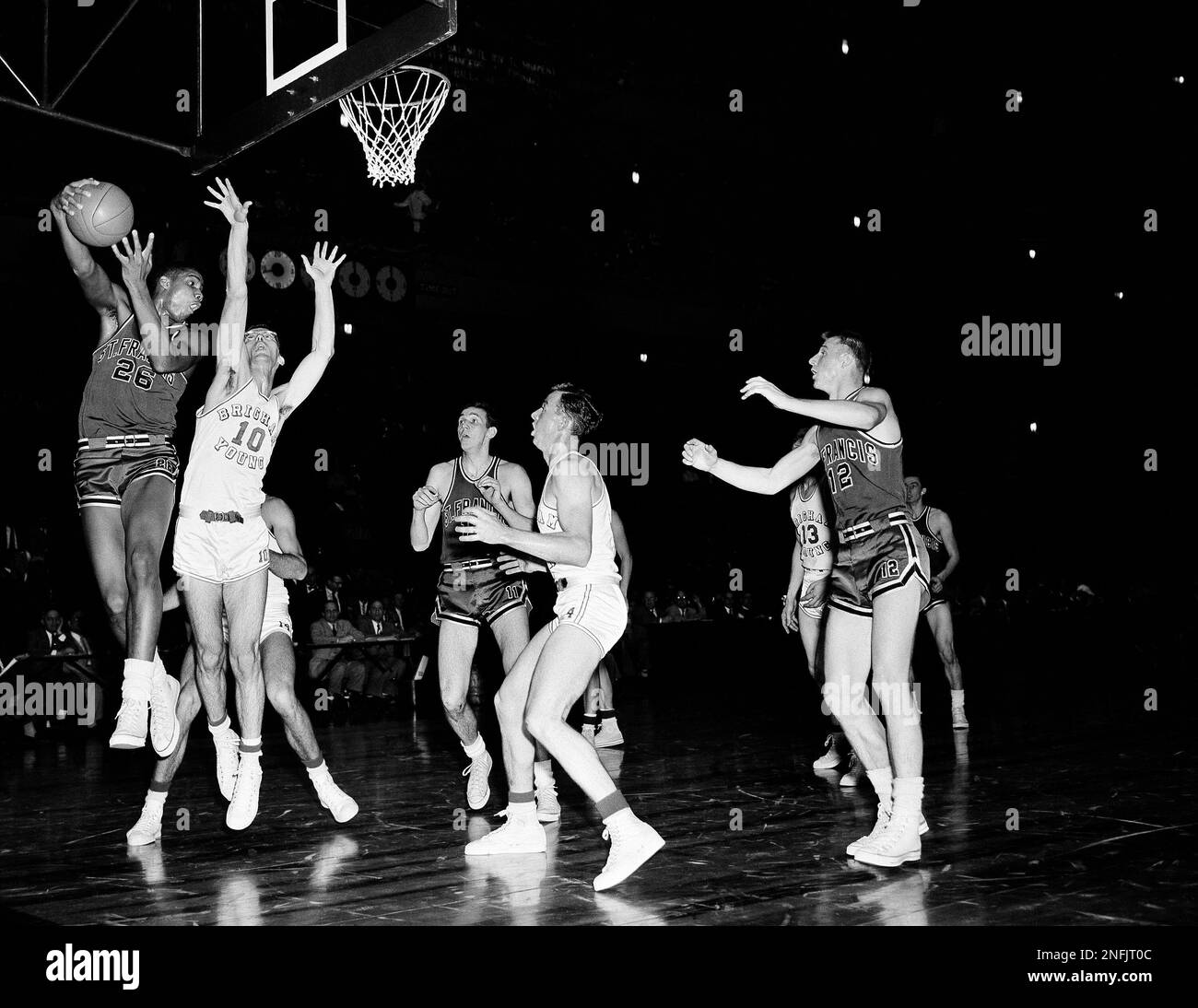 Maurice Stokes (26), six-foot, six-inch center for St. Francis grabs ...