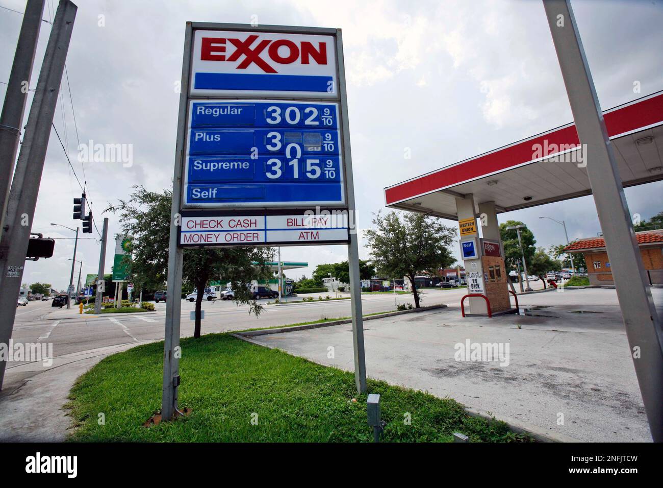 Gasoline prices at a boarded up Exxon station are shown well below the ...